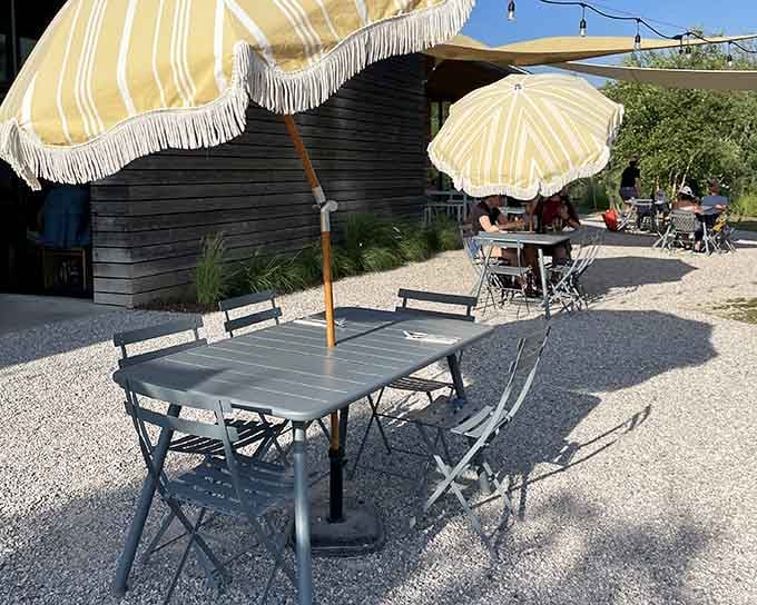Outdoor seating under cheerful umbrellas where your biggest decision is beer or cider with lunch.