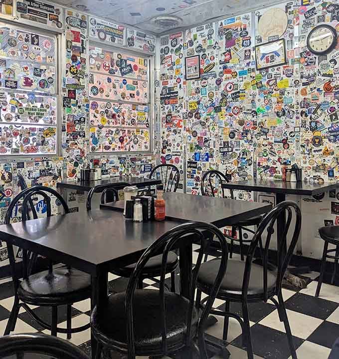 The dining room feels like eating inside a time capsule where every surface celebrates decades of diner culture.