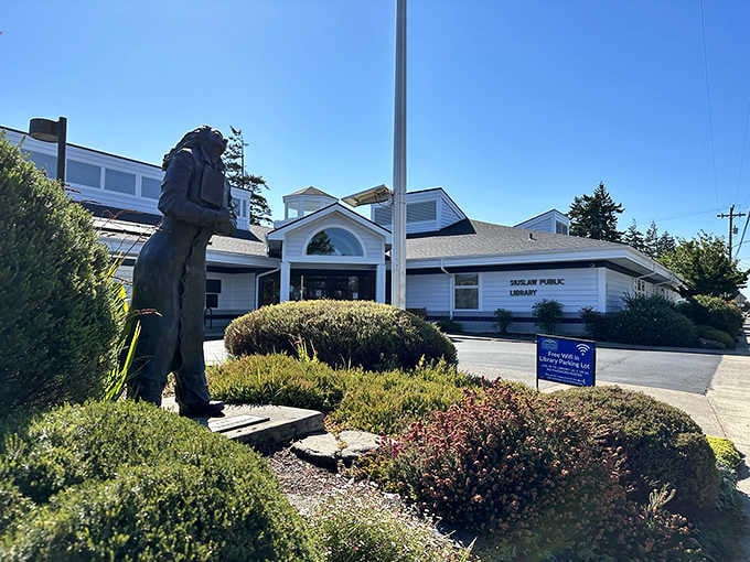 The public library welcomes visitors with a striking statue out front, proving that small towns take their literary culture seriously here.