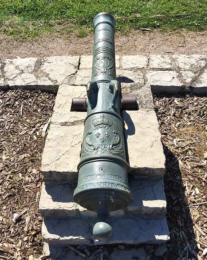 This bronze cannon bears French royal insignia, a genuine artifact from when Illinois was part of New France.