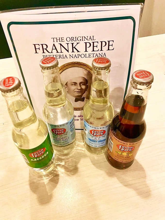 Even the beverages here come with history, offering authentic Italian sodas that complete the old-school pizzeria experience perfectly.