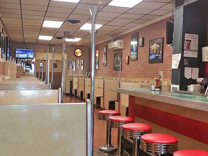 Booths and counter stretching into the distance, each seat holding decades of stories and satisfied appetites.