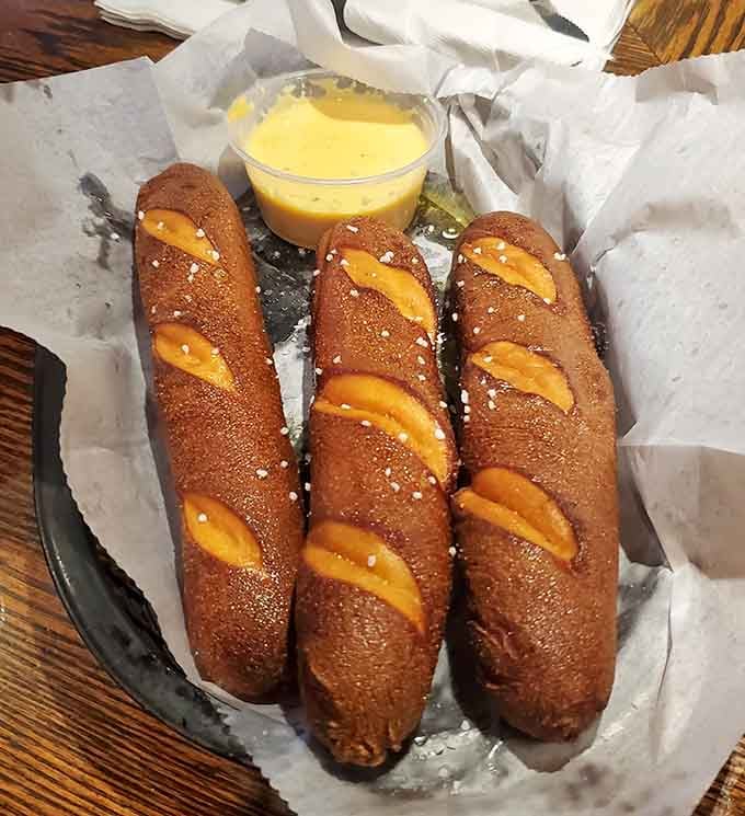 Soft pretzel sticks with cheese sauce turn simple comfort food into an art form worth celebrating.