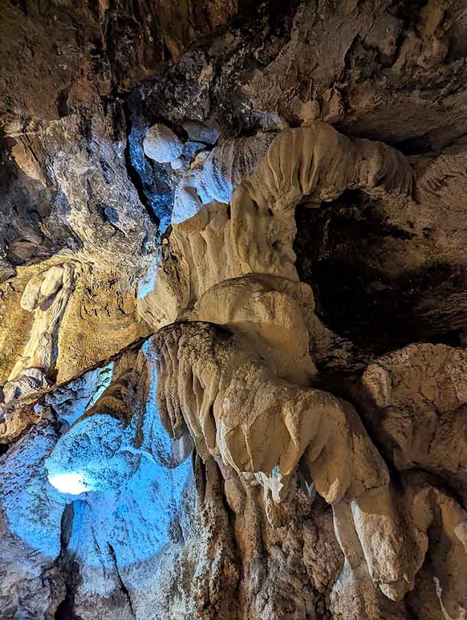 Flowstone formations cascade down cave walls like frozen honey, proving patience really does create something worth waiting for.