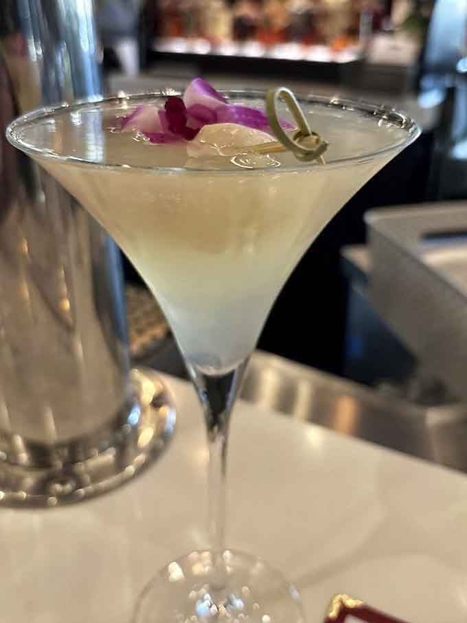 A lychee martini garnished with orchid petals brings unexpected elegance to your supper club experience, fancy pants optional.
