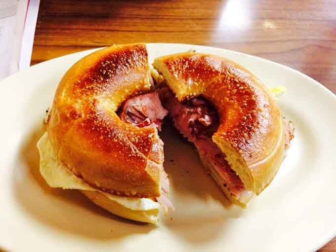 A breakfast bagel sandwich stuffed with ham and egg: portable comfort food that beats any drive-through by a country mile.