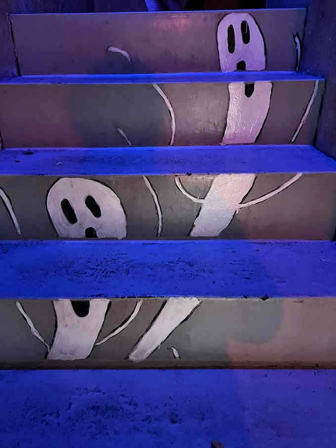 Even the stairs get decorated with ghostly faces, because apparently no surface is safe from the spooky treatment here.