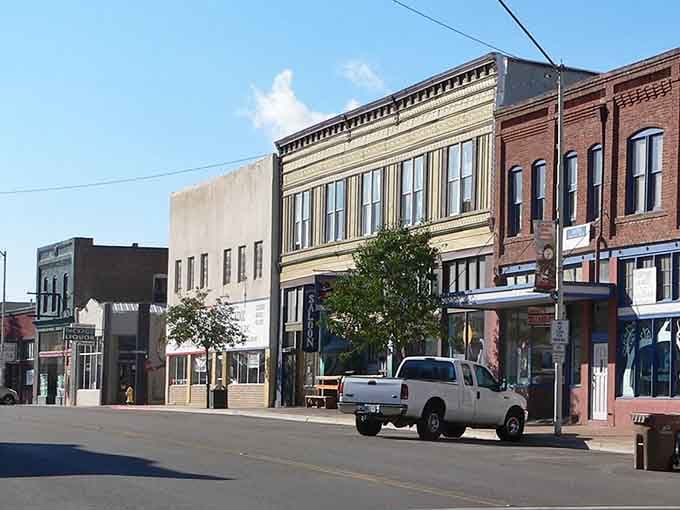 Historic storefronts line up like proud veterans, each one refusing to surrender to generic chain store blandness.