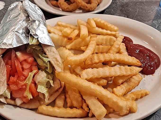 White subway tiles and pendant lights create an atmosphere where time slows down for proper dining.