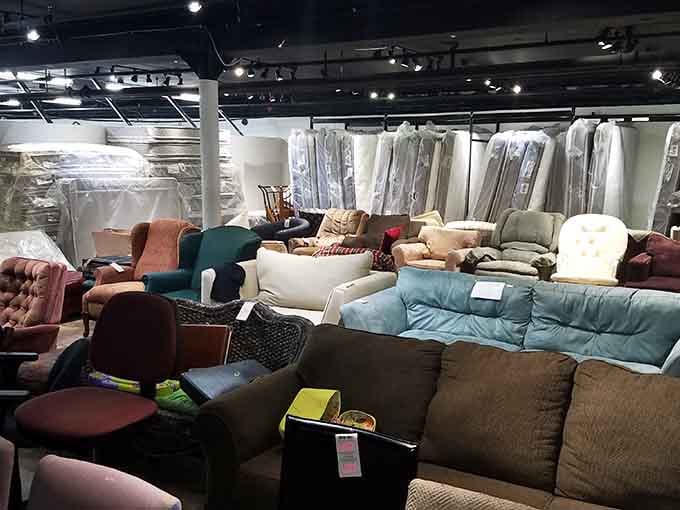 A sea of sofas and chairs in every color imaginable, like someone emptied every living room in Denver simultaneously.