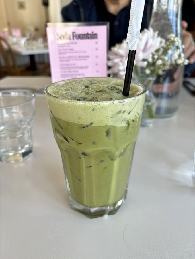 That vibrant green matcha latte looks like it teleported straight from a trendy Brooklyn caf&eacute; to the mountains.