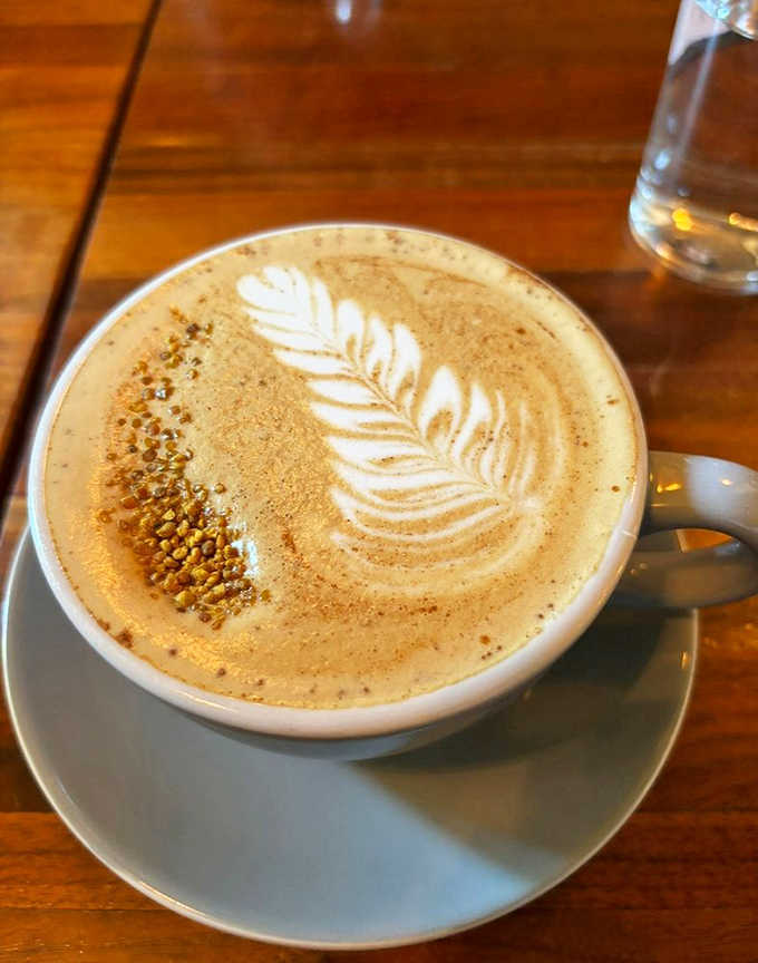 Latte art so pretty you almost feel guilty drinking it, but only almost, because coffee waits for no one.