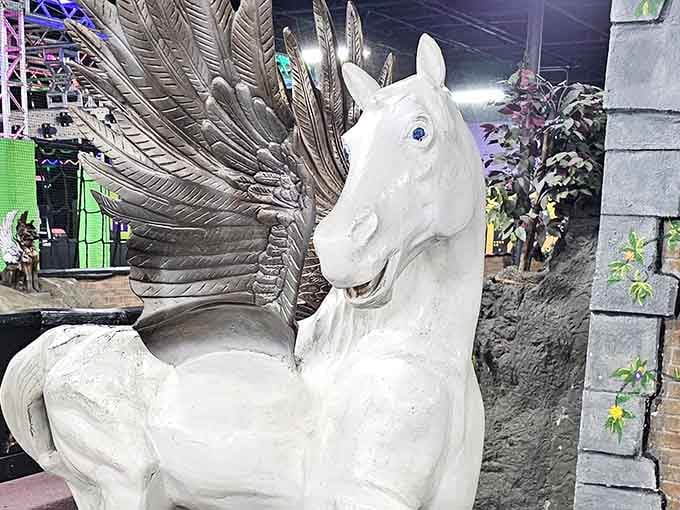 A majestic Pegasus guards the mini golf course, silently judging your putting technique with those knowing eyes.