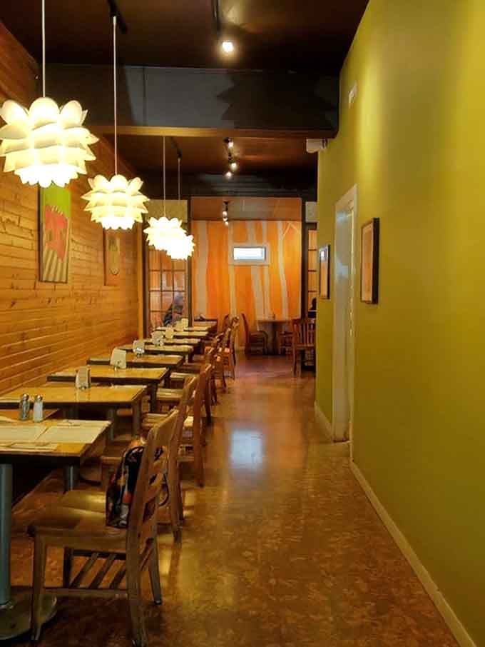 Those pendant lights and wooden tables create an atmosphere where you'll want to linger long after your plate's empty.