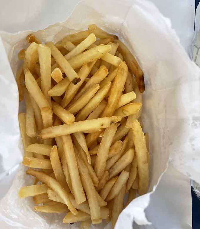 Golden, crispy fries that prove the perfect burger needs the perfect sidekick to complete the meal experience.