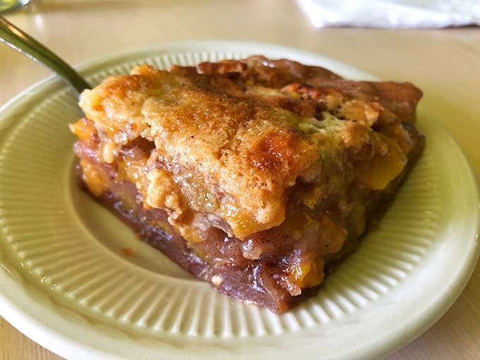 Peach cobbler that looks like summer decided to become dessert, with a crust that's flaky, buttery, and absolutely worth the calories.