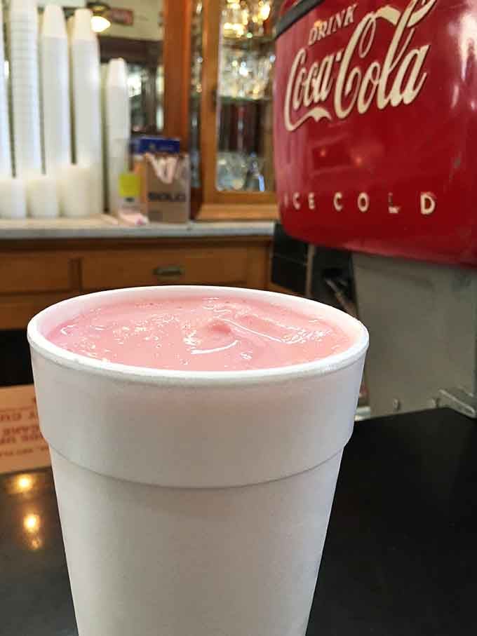 This pink milkshake served in a classic foam cup is exactly what you'd order at Arnold's Drive-In.