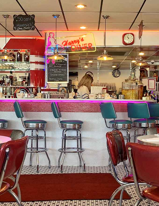 That counter setup with its neon glow makes you want to grab a stool and order everything twice.