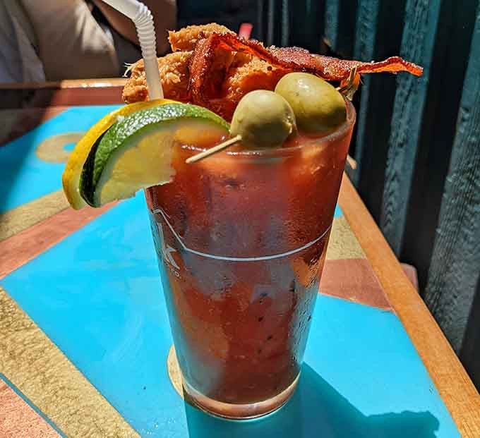 This Bloody Mary comes dressed to impress with bacon, olives, and enough garnishes to qualify as an appetizer.