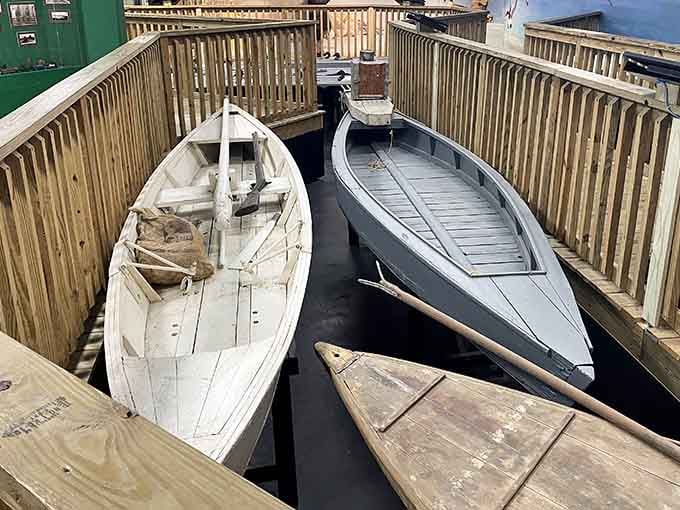 Authentic hunting boats remind visitors that these decoys were working tools, not just art.