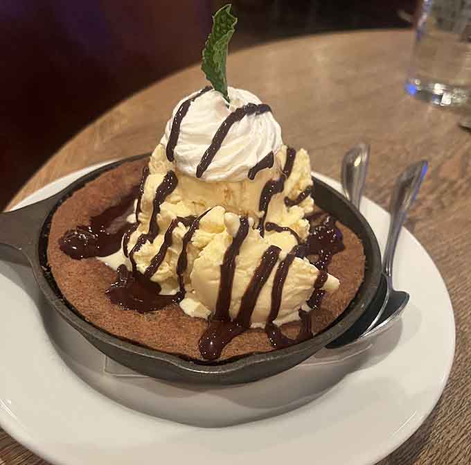 Warm chocolate chip skillet cookie with vanilla ice cream, because sharing is caring but nobody's judging if you don't.