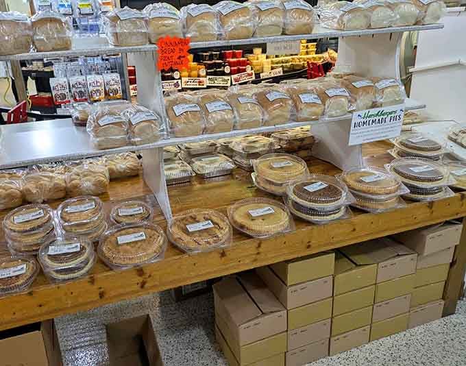 Homemade pies stacked like edible architecture, each one a masterclass in why shortcuts never taste this good, period.