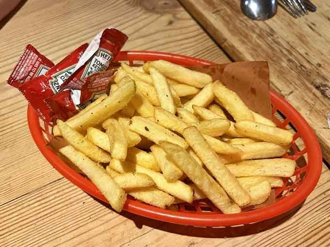 The bar showcases enough whiskey to make a Texan weep with joy, all backlit like liquid gold treasure.