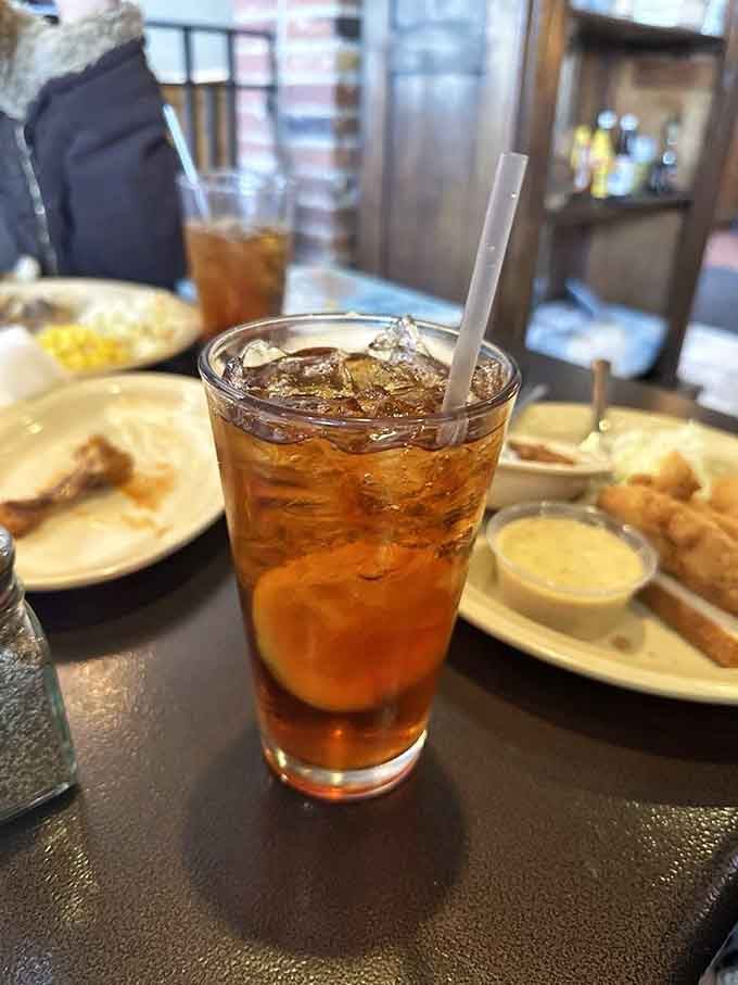 A perfectly poured iced tea waiting patiently while the real stars of the show arrive at your table.