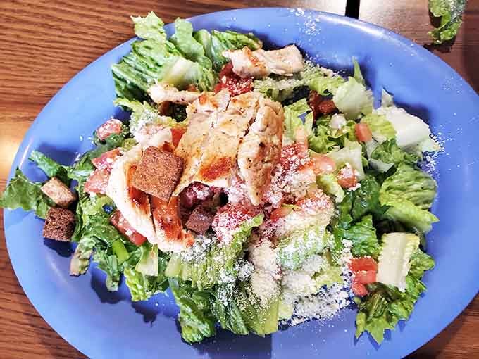 Fresh salads piled high prove this place takes every menu category seriously, even the healthy stuff.