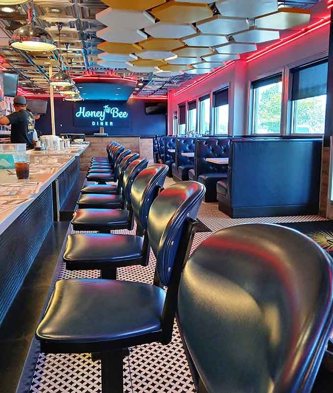 Counter seating where the chrome shines, the stools spin, and breakfast dreams are made one order at a time.