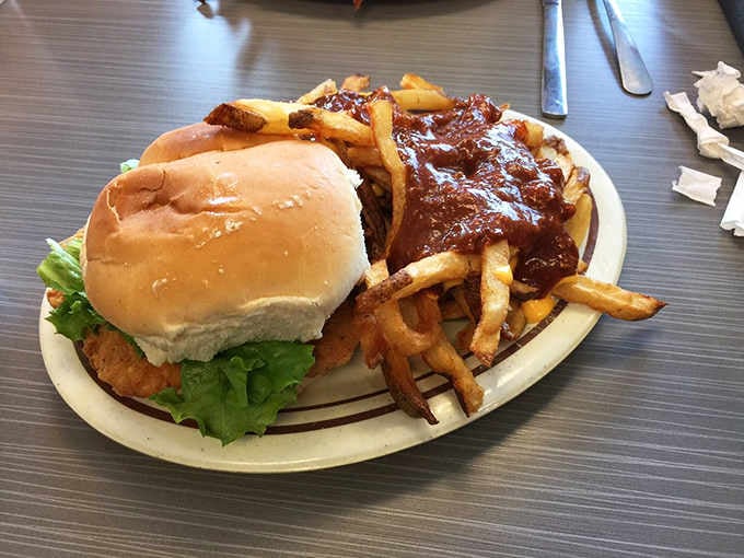 A chicken sandwich and cheese-smothered hot dog proving that variety truly is the spice of affordable life.