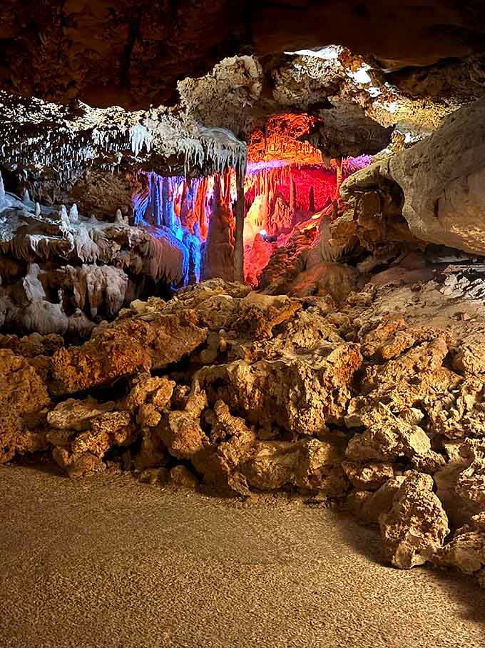 Dramatic colored lighting transforms the cavern into nature's own light show, highlighting every incredible detail.