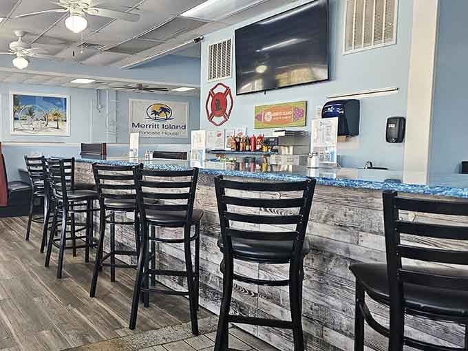 That counter area with the bar seating is perfect for solo diners who want front-row seats to breakfast magic.