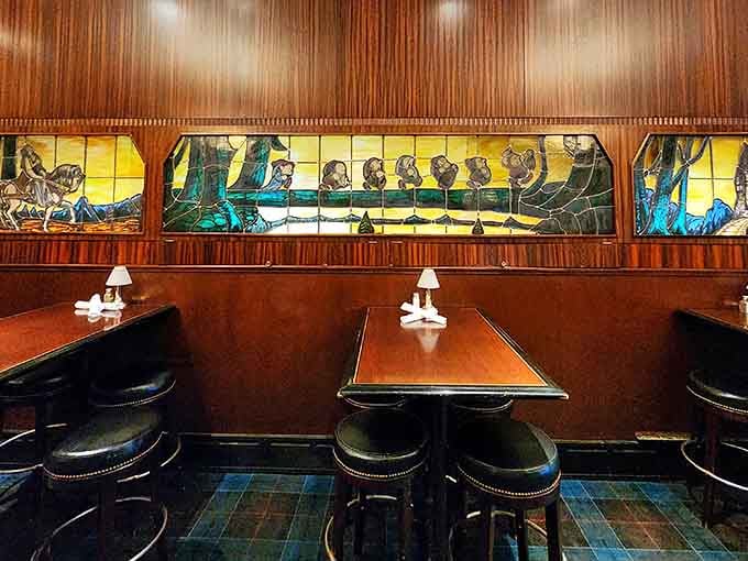 Stained glass and booth seating that transport you to an era when dining out meant something special.
