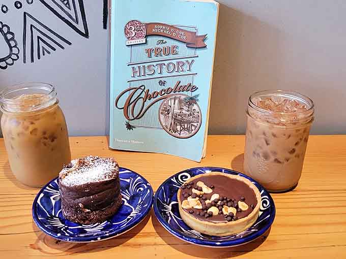 Iced coffee and desserts paired with chocolate history books create the perfect afternoon escape from reality.
