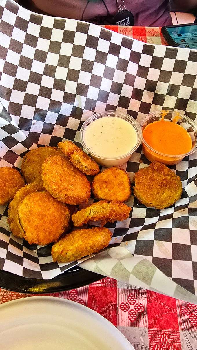 Fried pickles with two dipping sauces, because sometimes the best discoveries are the crunchiest ones available.
