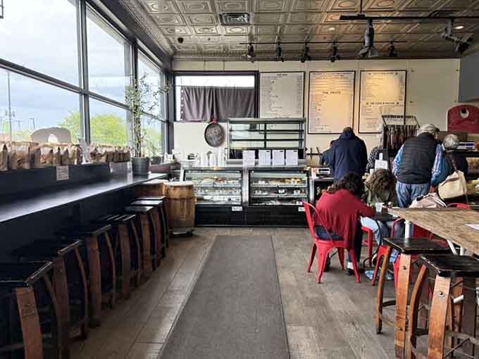 Large windows flood the space with natural light, making every sandwich look like it deserves its own photoshoot.