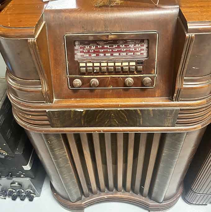 A vintage radio sits among the museum displays, reminding visitors when entertainment required actual knobs and patience to find stations.