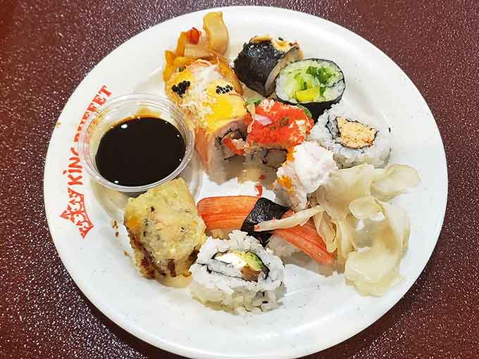 The sushi selection at a buffet always feels like finding a surprise gift, fresh rolls ready for adventure.