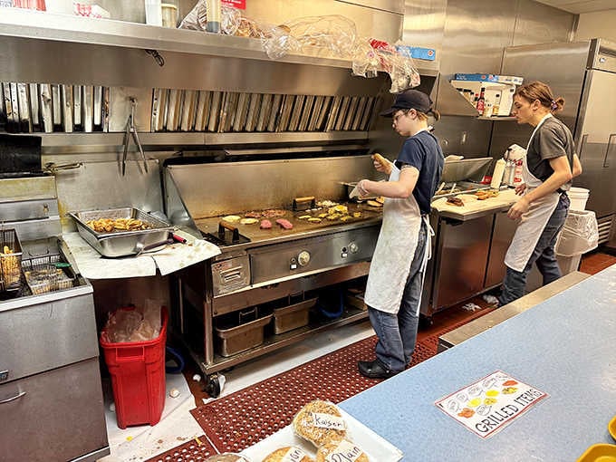 Behind that griddle, burgers get assembled with the precision of a surgical team and the speed of a NASCAR pit crew.