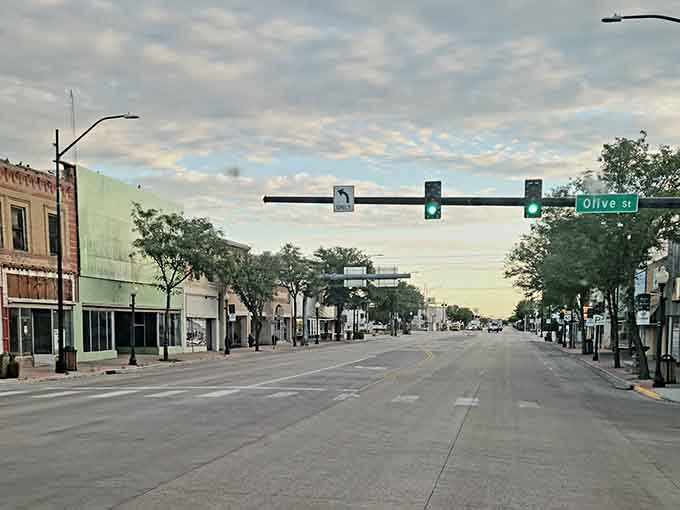 Olive Street at dusk captures that timeless small-town feeling where traffic lights outnumber the cars passing through.