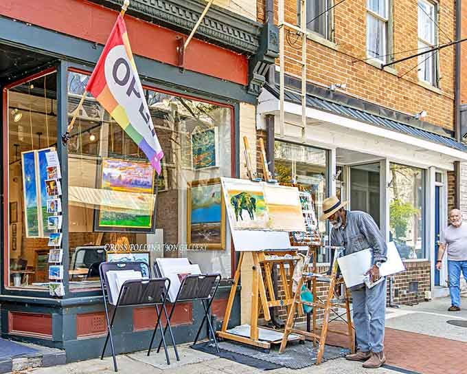 Street artists set up easels outdoors because when your town looks this good, why paint anything else anywhere?