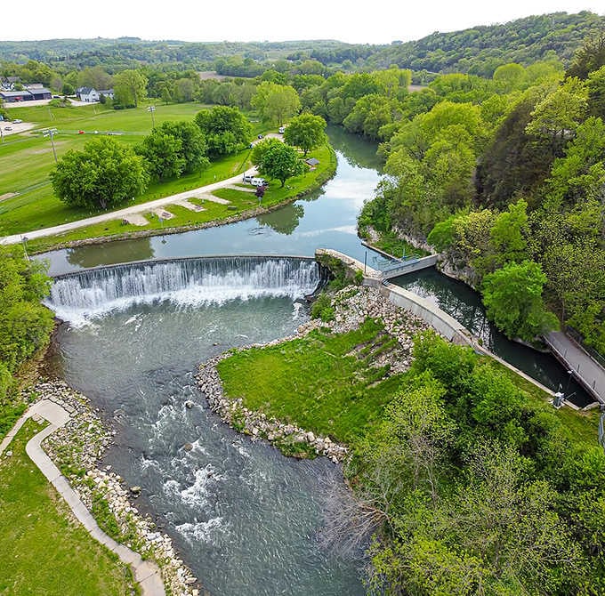 The dam creates a peaceful waterfall that's been the town's soundtrack for over a century now.