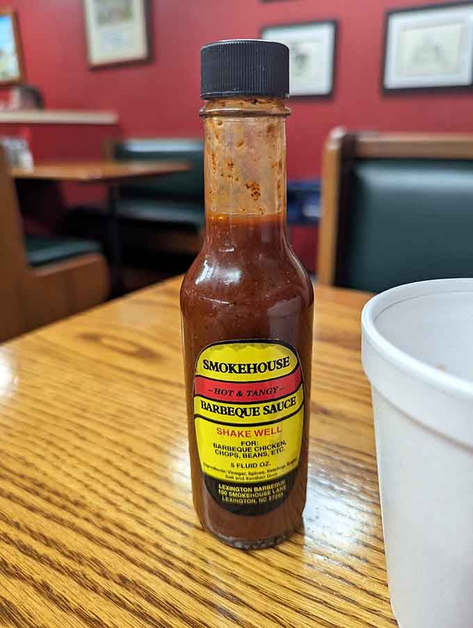 That sauce bottle sits on every table like a tiny delicious superhero ready to save your meal.