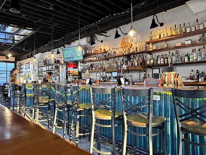 The bar area gleams with possibility, where good drinks meet good company in perfectly balanced harmony.