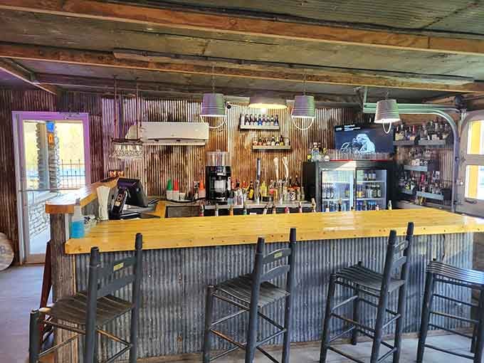 A rustic bar with corrugated metal that says "we're fancy but we won't judge your jeans."