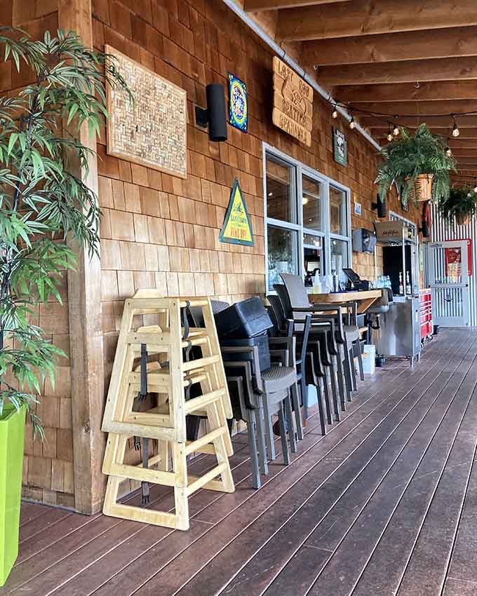 The covered porch with bar seating lets you enjoy coastal breezes while sipping something cold and delicious.