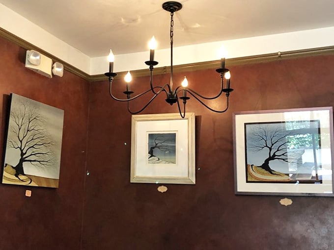 Rich brown walls and carefully curated artwork create an atmosphere that's both sophisticated and completely unpretentious.