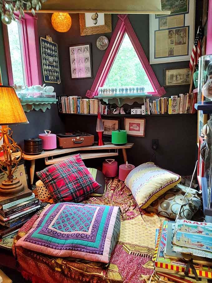 This cozy reading nook with its triangle window makes you want to curl up with a good book immediately.