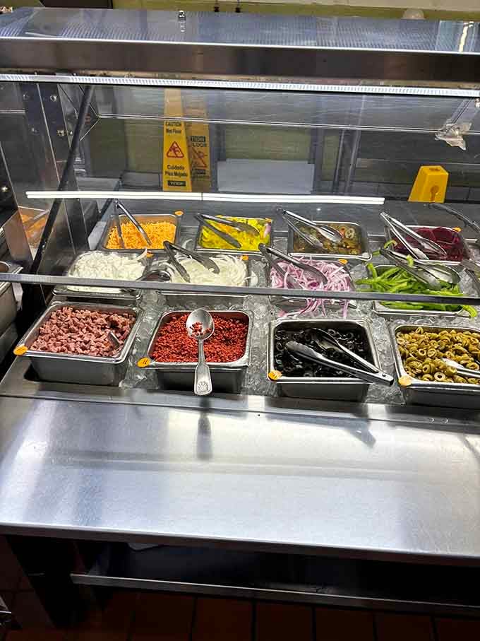 The salad bar offers fresh options for those brief moments when you remember vegetables exist beyond fried.